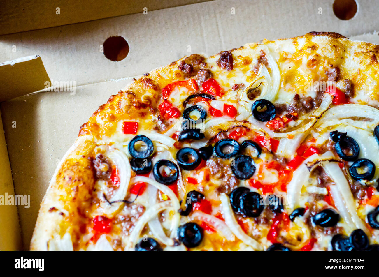 Delicious pizza in cardboard, pizza delivered to your home in a special ...