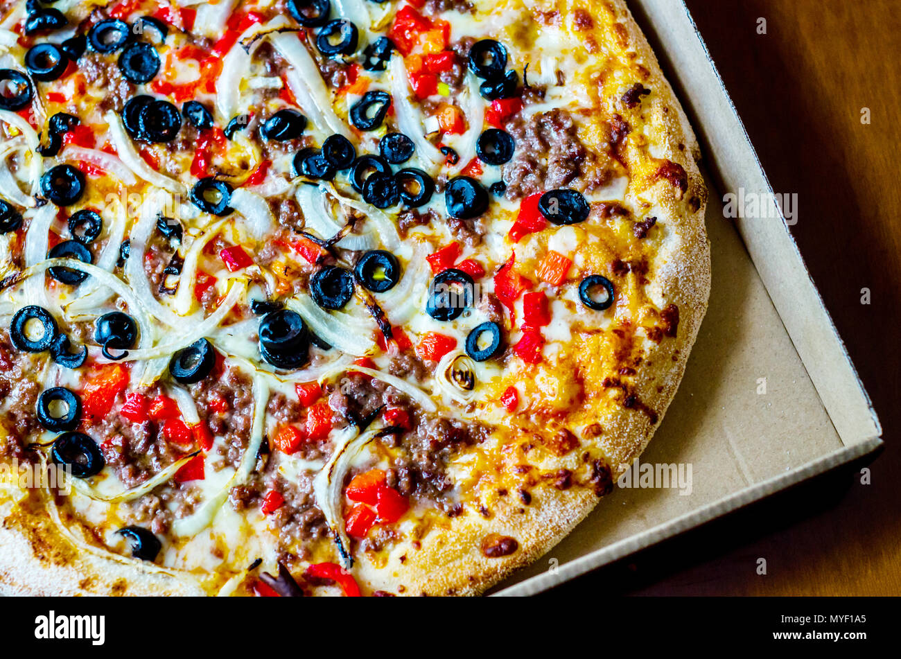 Delicious pizza in cardboard, pizza delivered to your home in a special ...