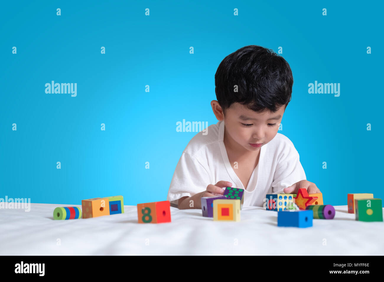 3 years old little cute Asian boy play toy or square block puzzle at ...