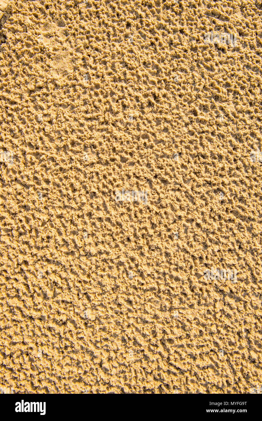 Sand of a beach with rain holes Stock Photo - Alamy