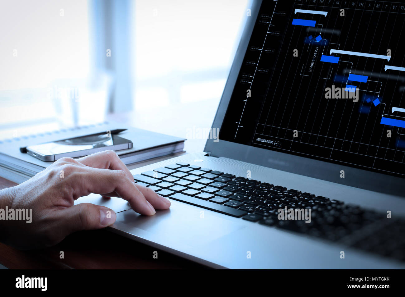 Project manager working and update tasks with milestones progress ...