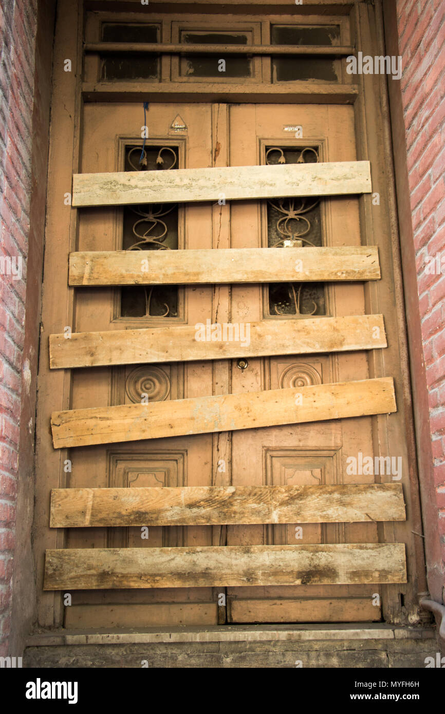 Old styled wooden door of an old building Stock Photo - Alamy