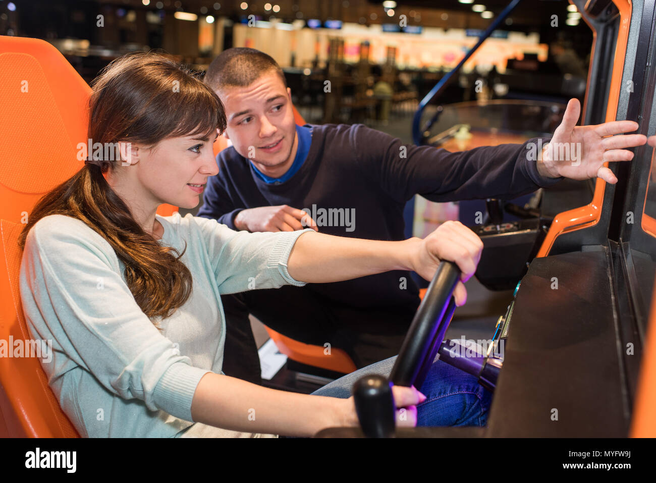 woman is playing a car driving game Stock Photo - Alamy