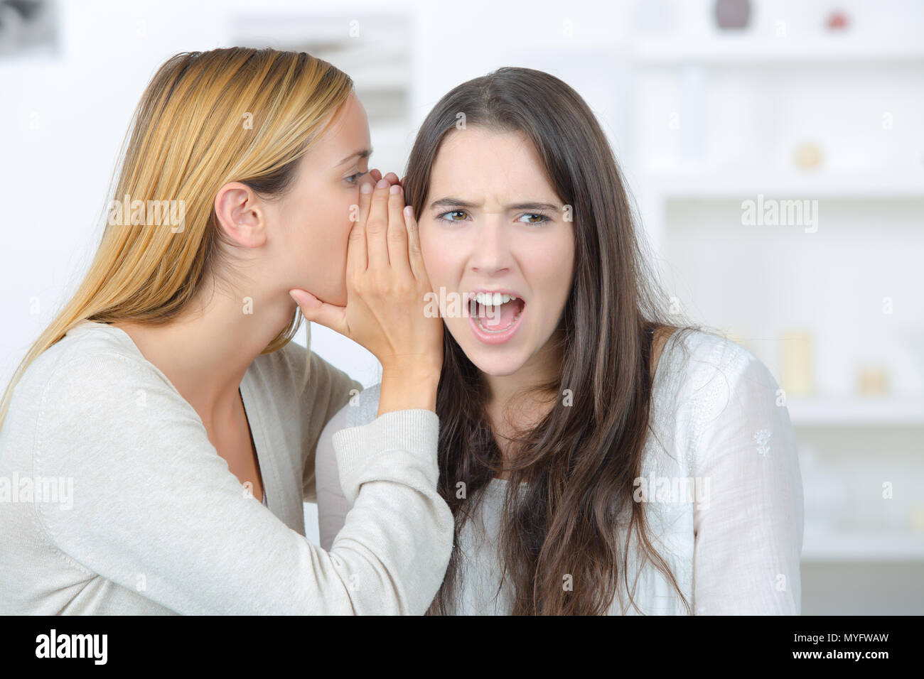 Telling rumors hi-res stock photography and images - Alamy