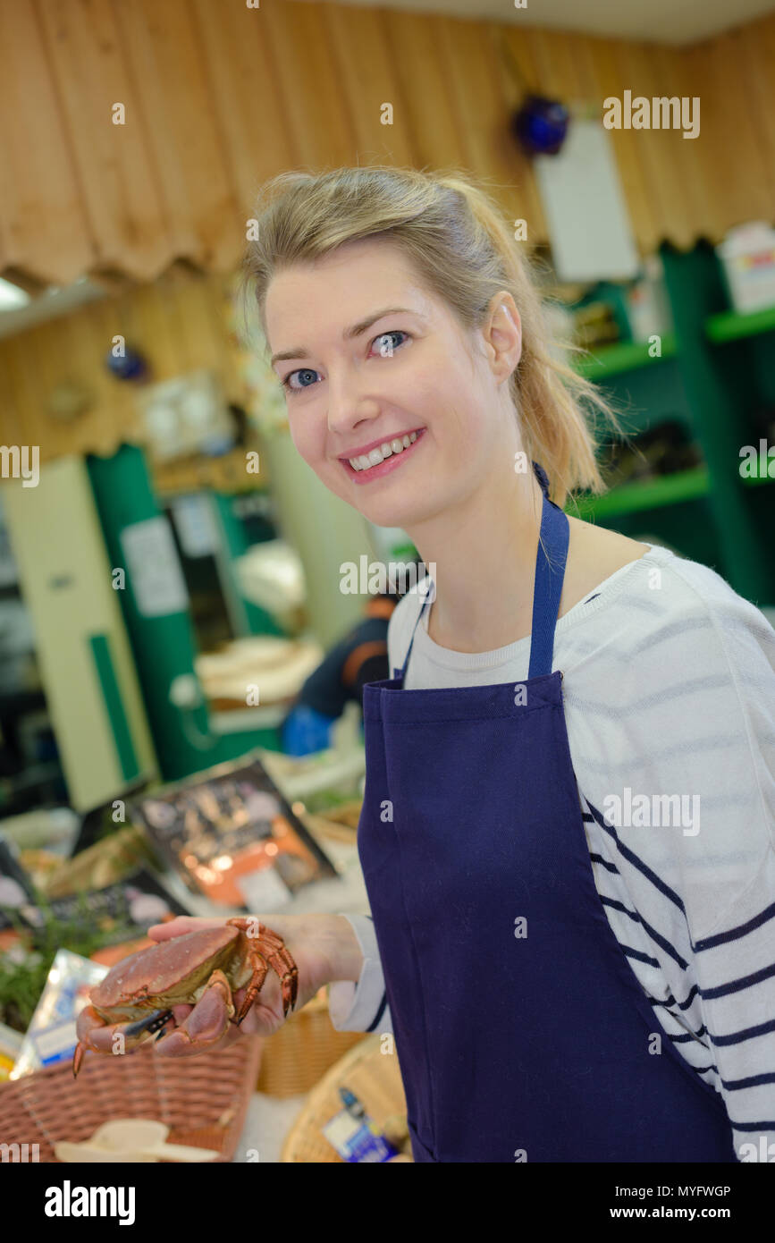 female fishmonger smiling Stock Photo - Alamy