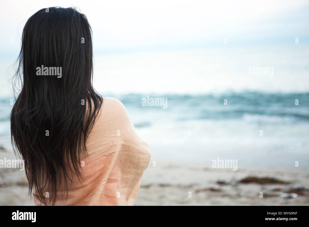 Beautiful confident Asian woman standing on the beach Stock Photo - Alamy