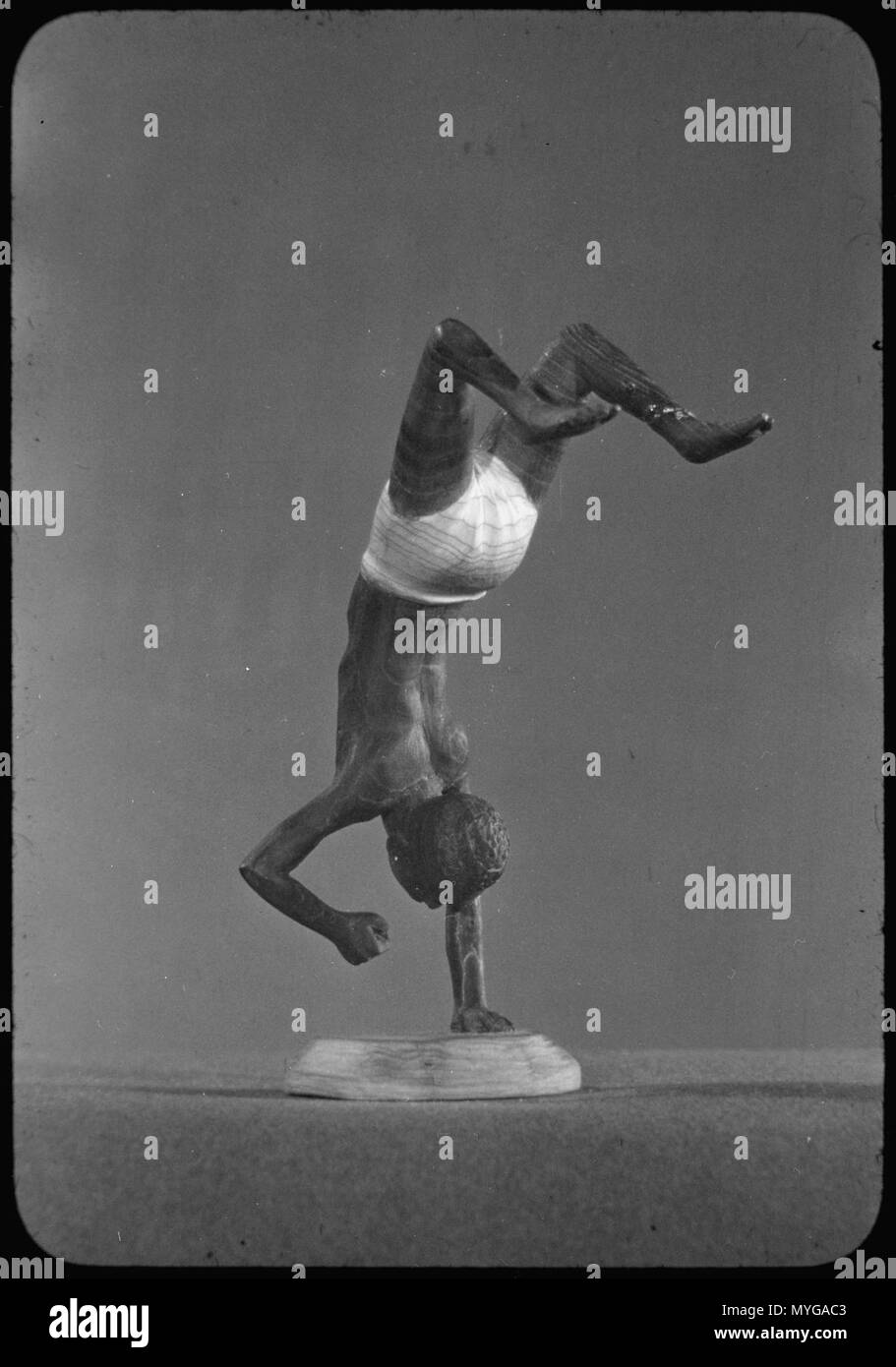 Boy balancing on one hand Stock Photo - Alamy