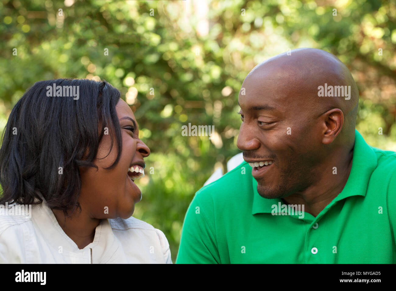 African American Couple talking and laughing outside Stock Photo - Alamy