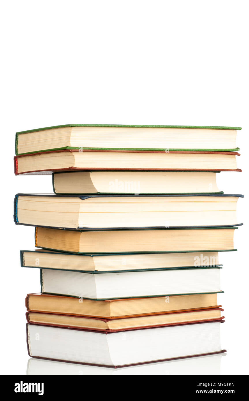 Photo of a book heap isolated on white background Stock Photo - Alamy
