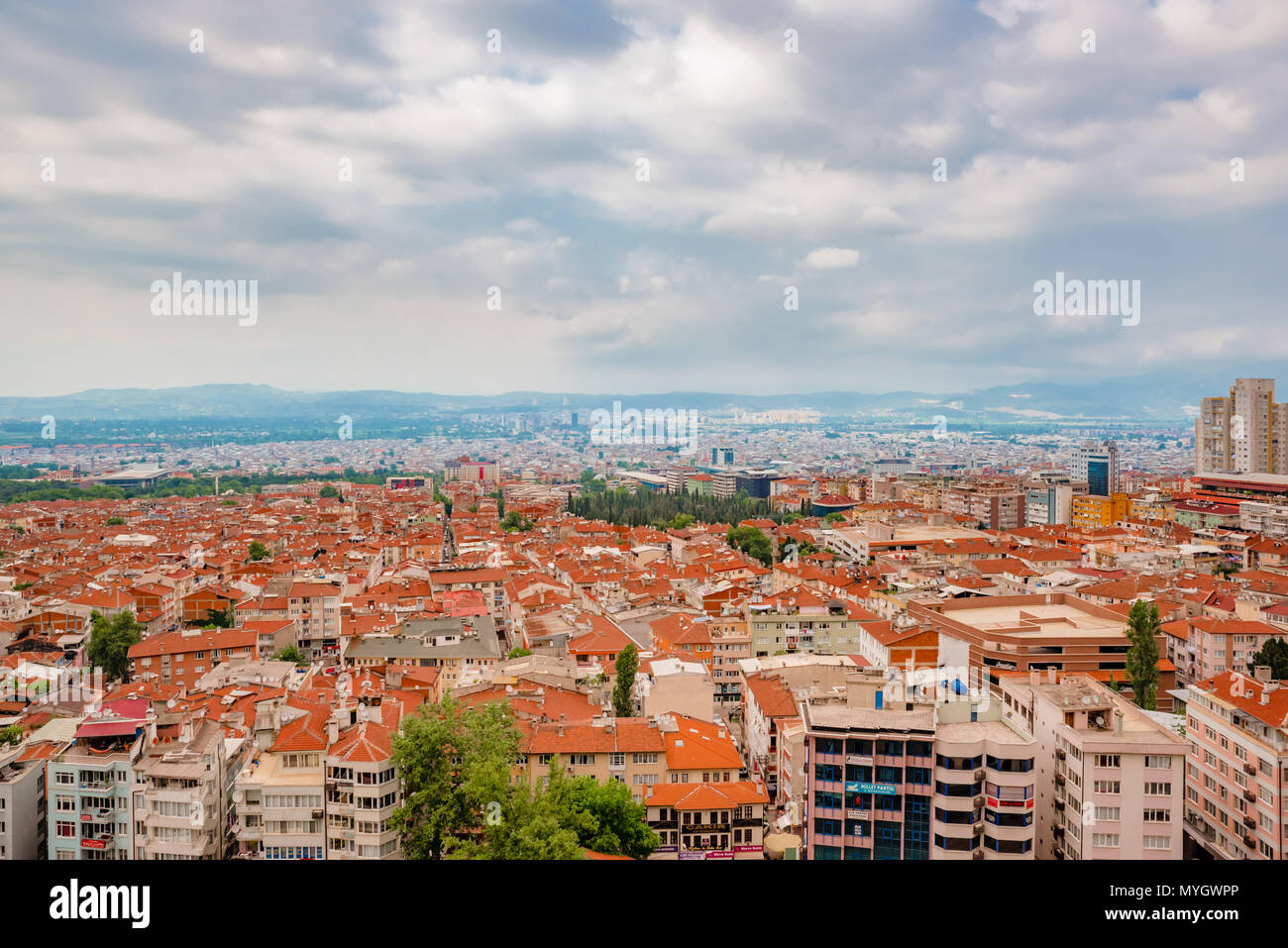 Aerial cityscape view of Bursa city center with a blue cloudy sky ...