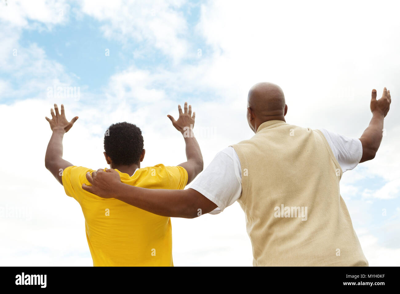 African American father and teen son with open arms Stock Photo - Alamy