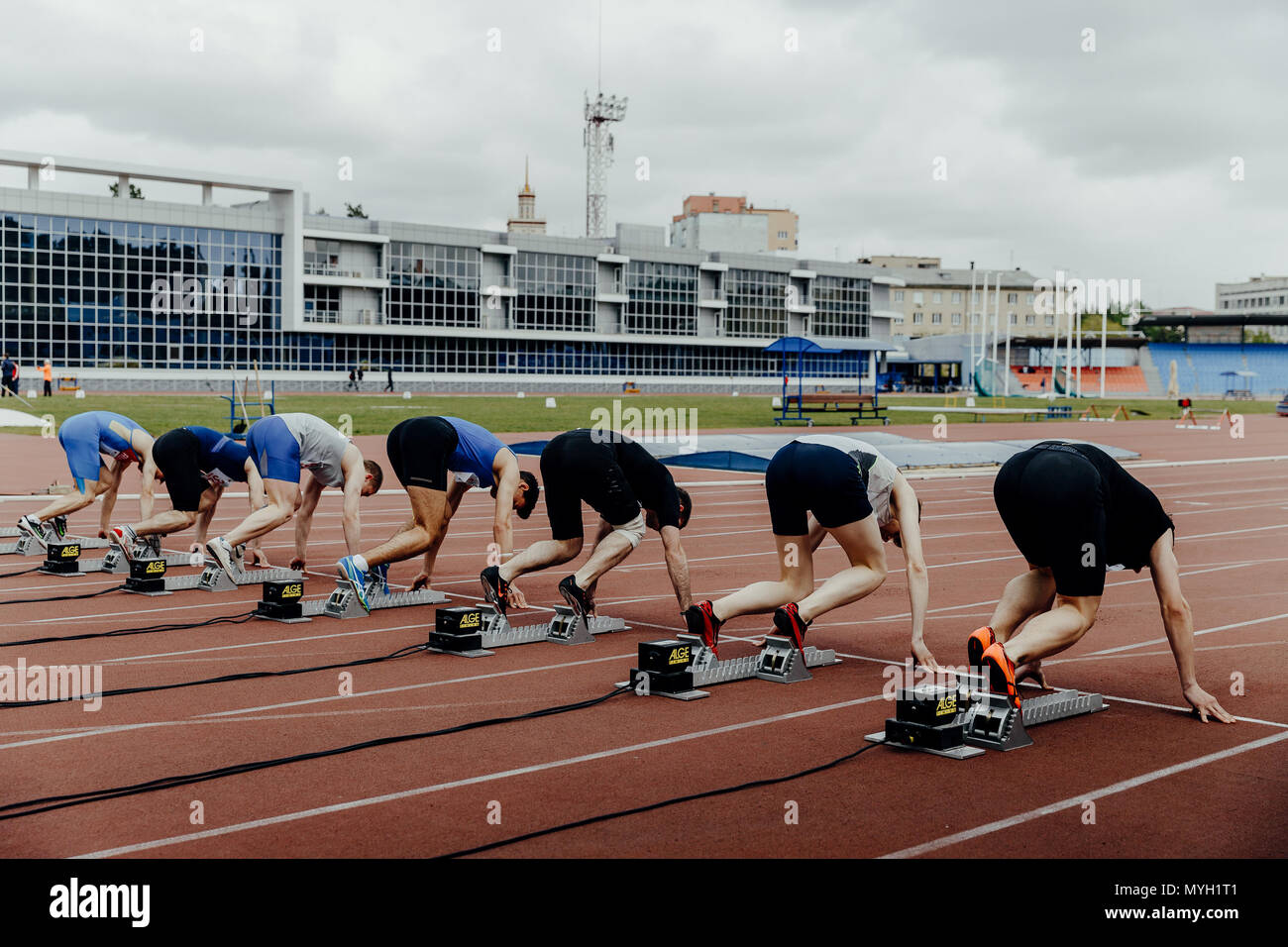 starting line male sprinters at 100 meters running during UrFO ...