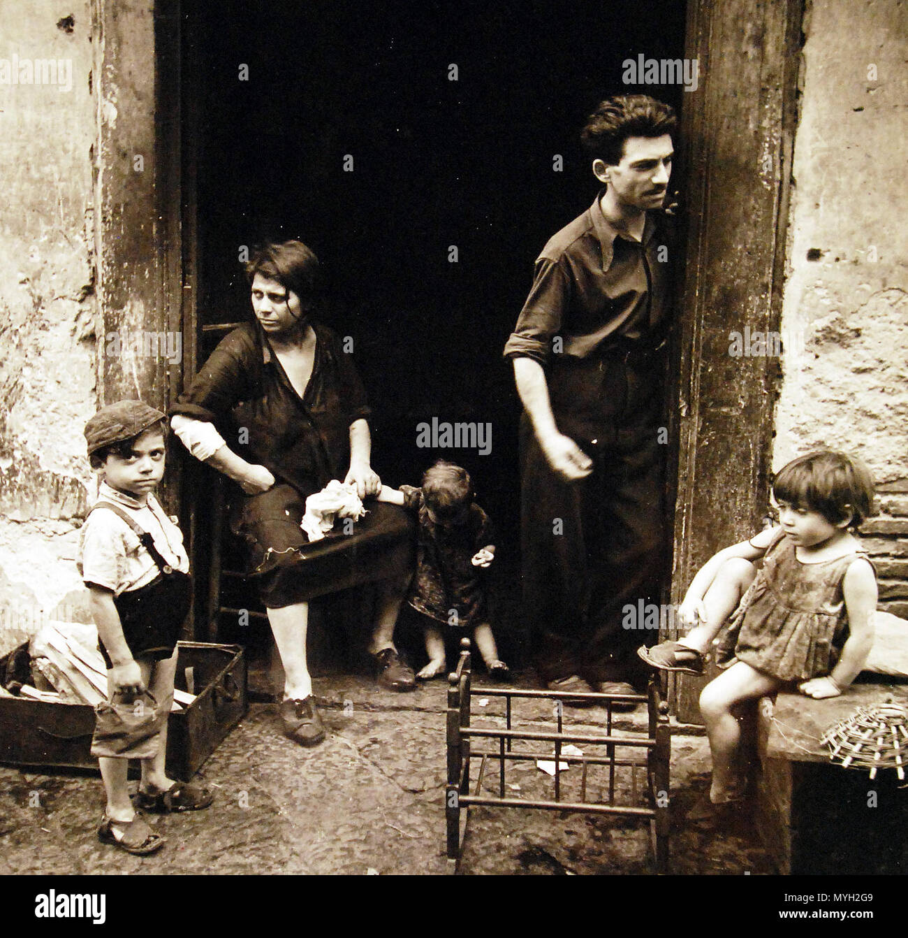 Children of Naples. Children play while mother works. August 1944 Stock ...