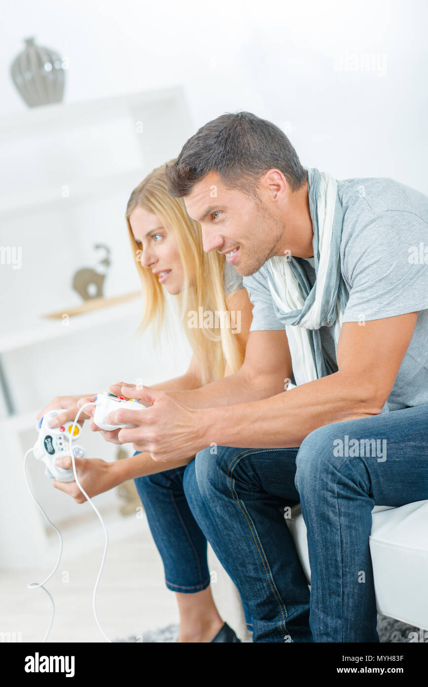 Couple playing video games Stock Photo - Alamy