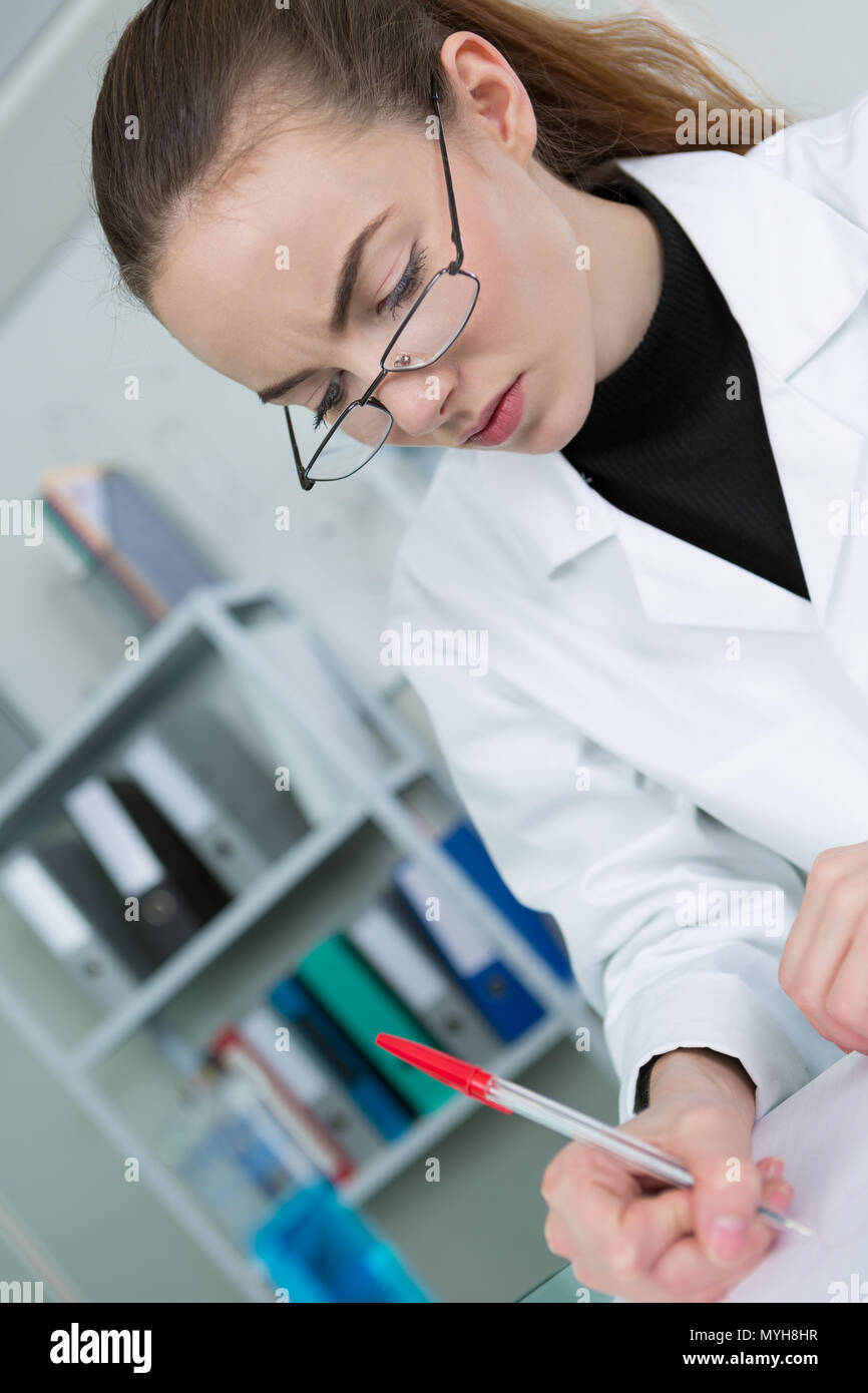 portrait of an attractive young researcher taking notes Stock Photo - Alamy