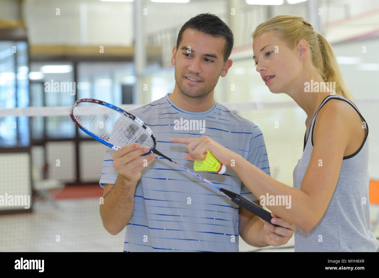 Happy people playing badminton together hi-res stock photography and ...