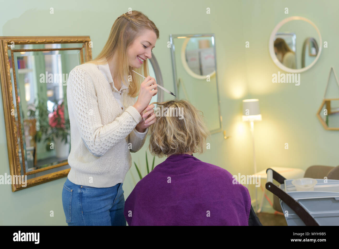 professional hairdresser doing hair-colouring Stock Photo - Alamy