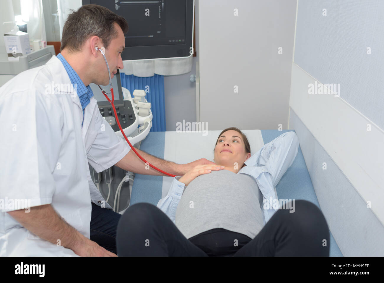 pregnant woman having a prenatal checkup Stock Photo - Alamy