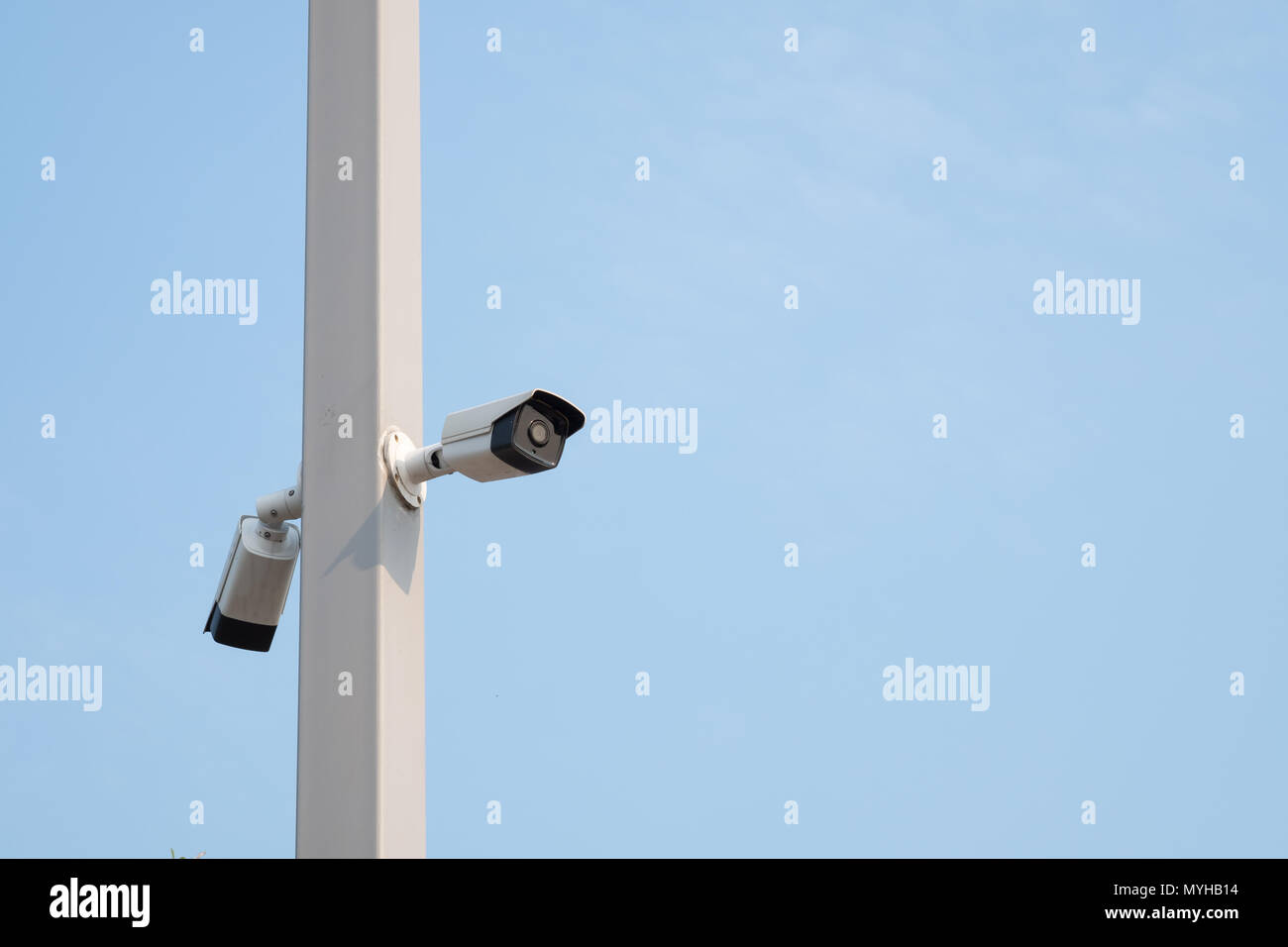 CCTV Camera. Security surveillance system with blue sky Stock Photo - Alamy