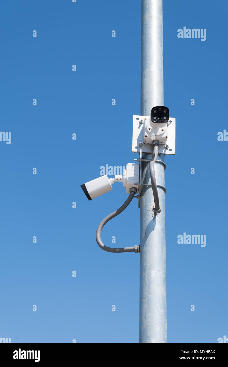 CCTV Camera. Security surveillance system with blue sky Stock Photo - Alamy