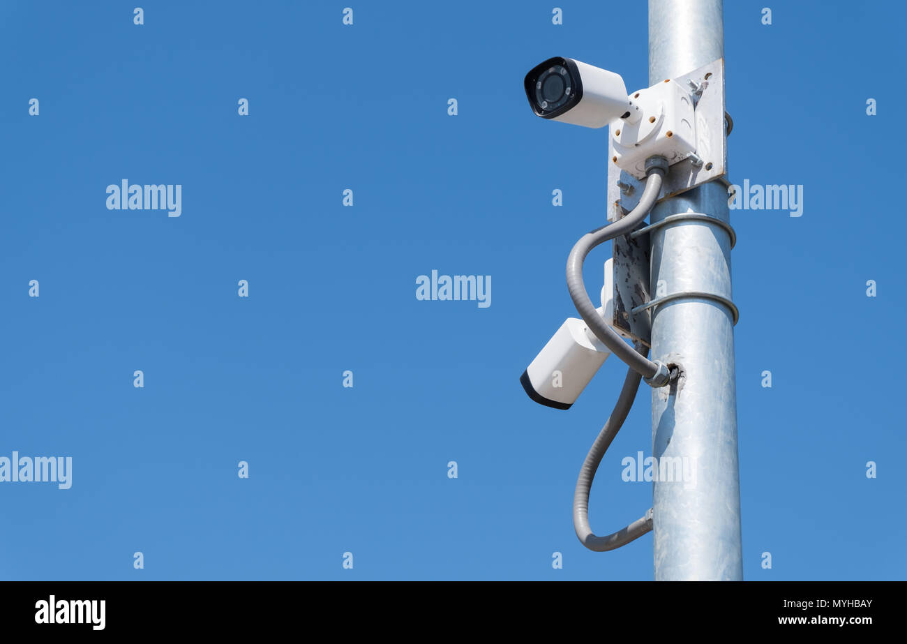 CCTV Camera. Security surveillance system with blue sky Stock Photo - Alamy