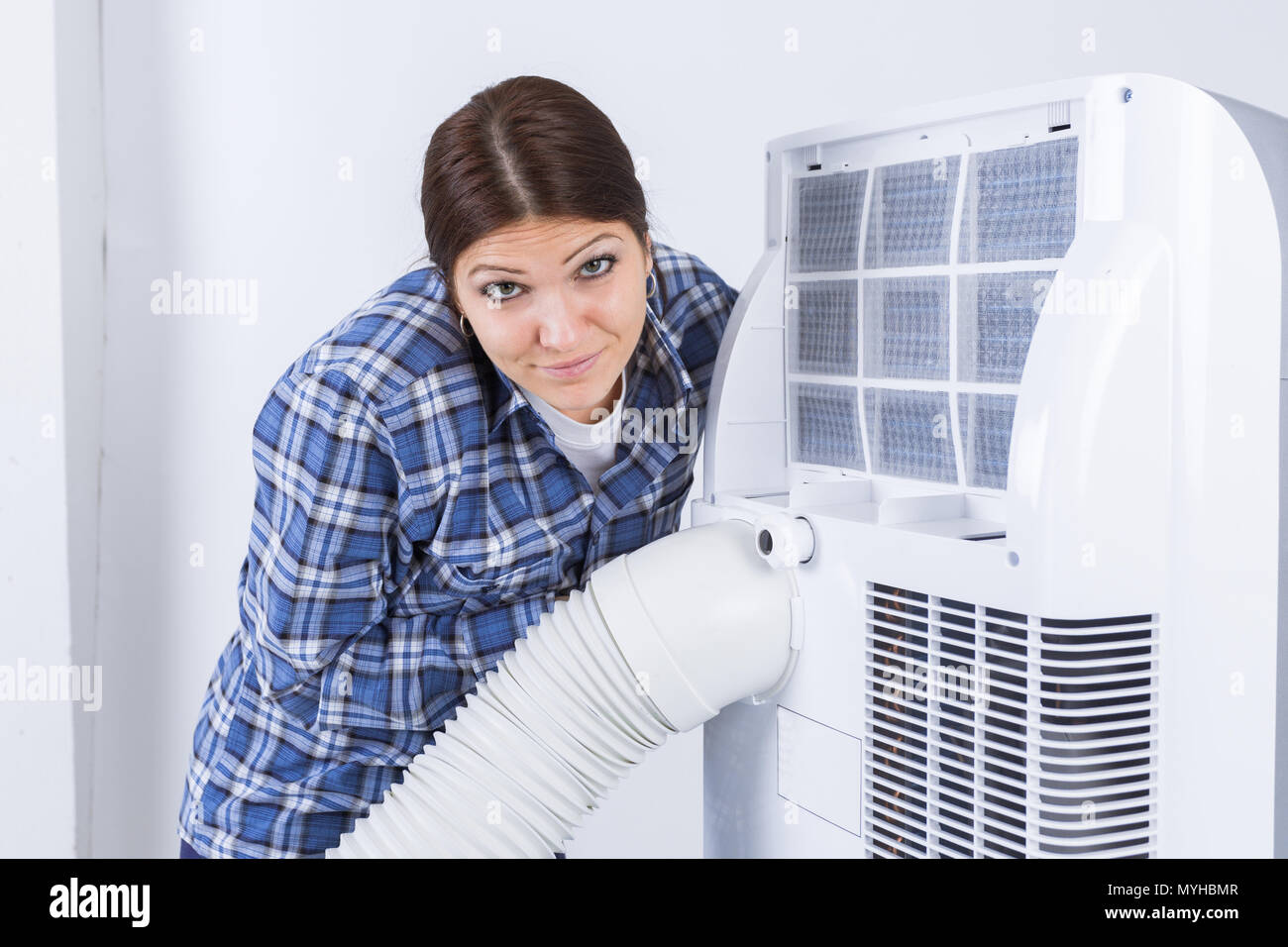 female worker with air conditioning pipes Stock Photo - Alamy