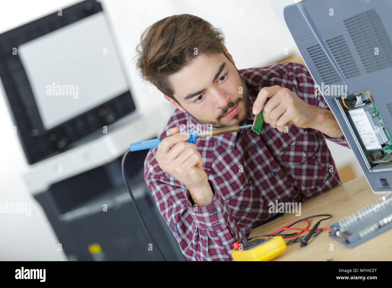 man welding computer parts Stock Photo - Alamy