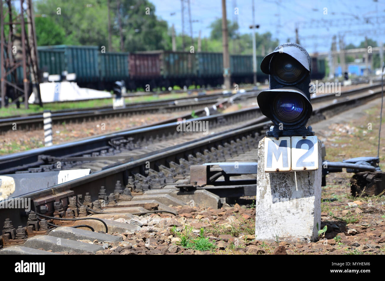 Railway traffic light (semaphore) against the background of a day ...