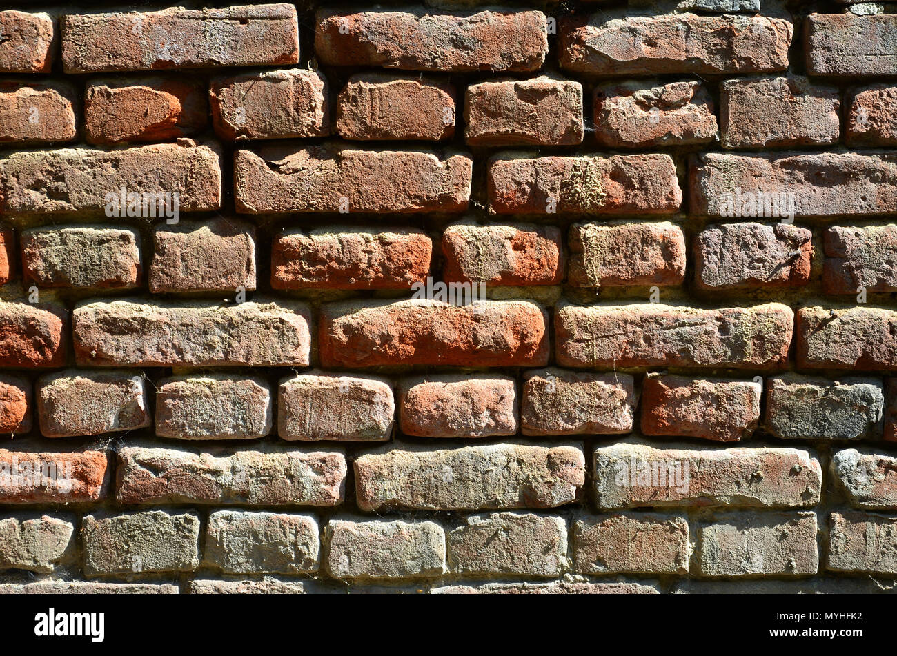 Horizontal wall texture of several rows of very old brickwork made of ...