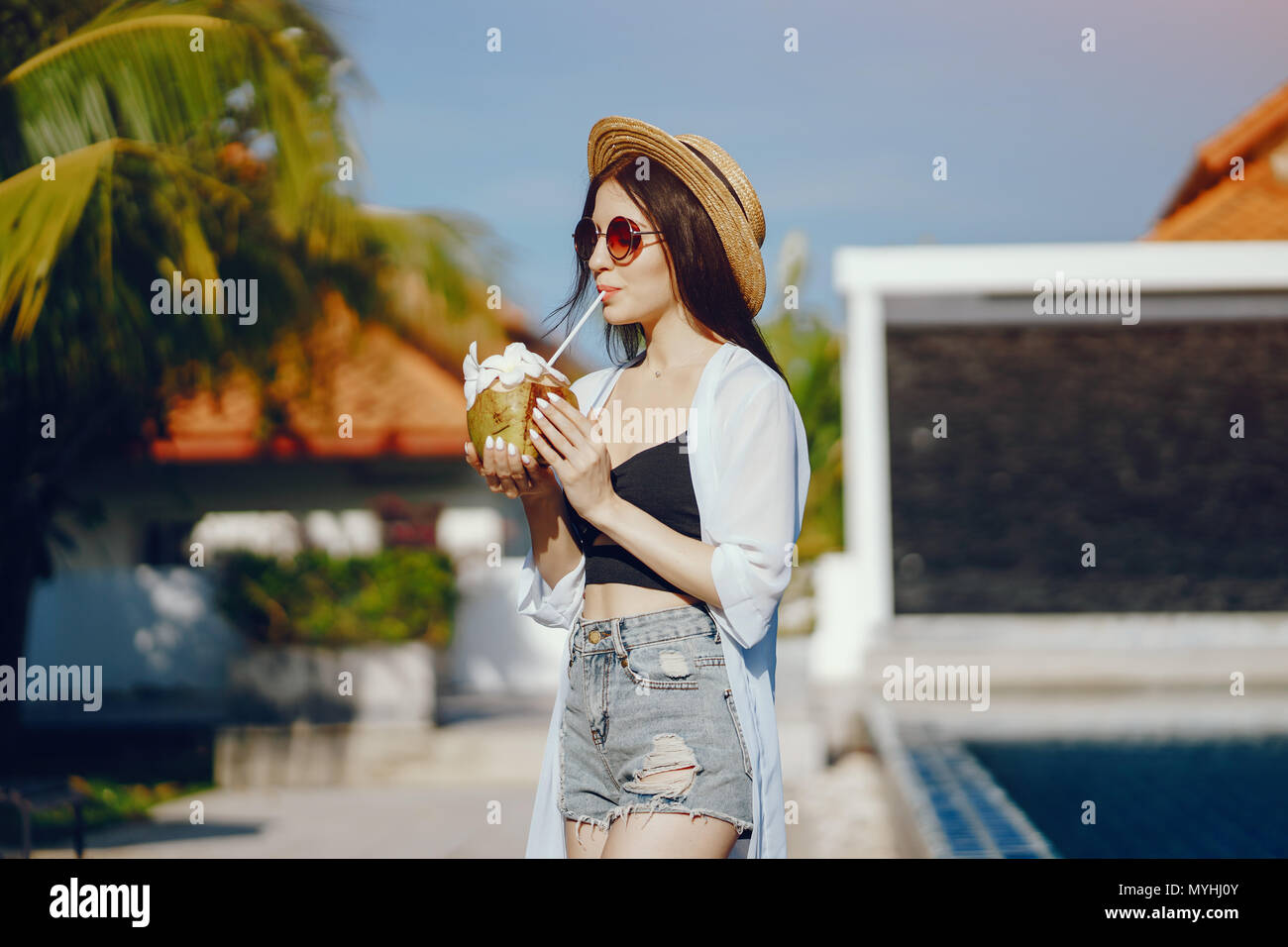 Attractive woman coconut drink hi-res stock photography and images - Alamy
