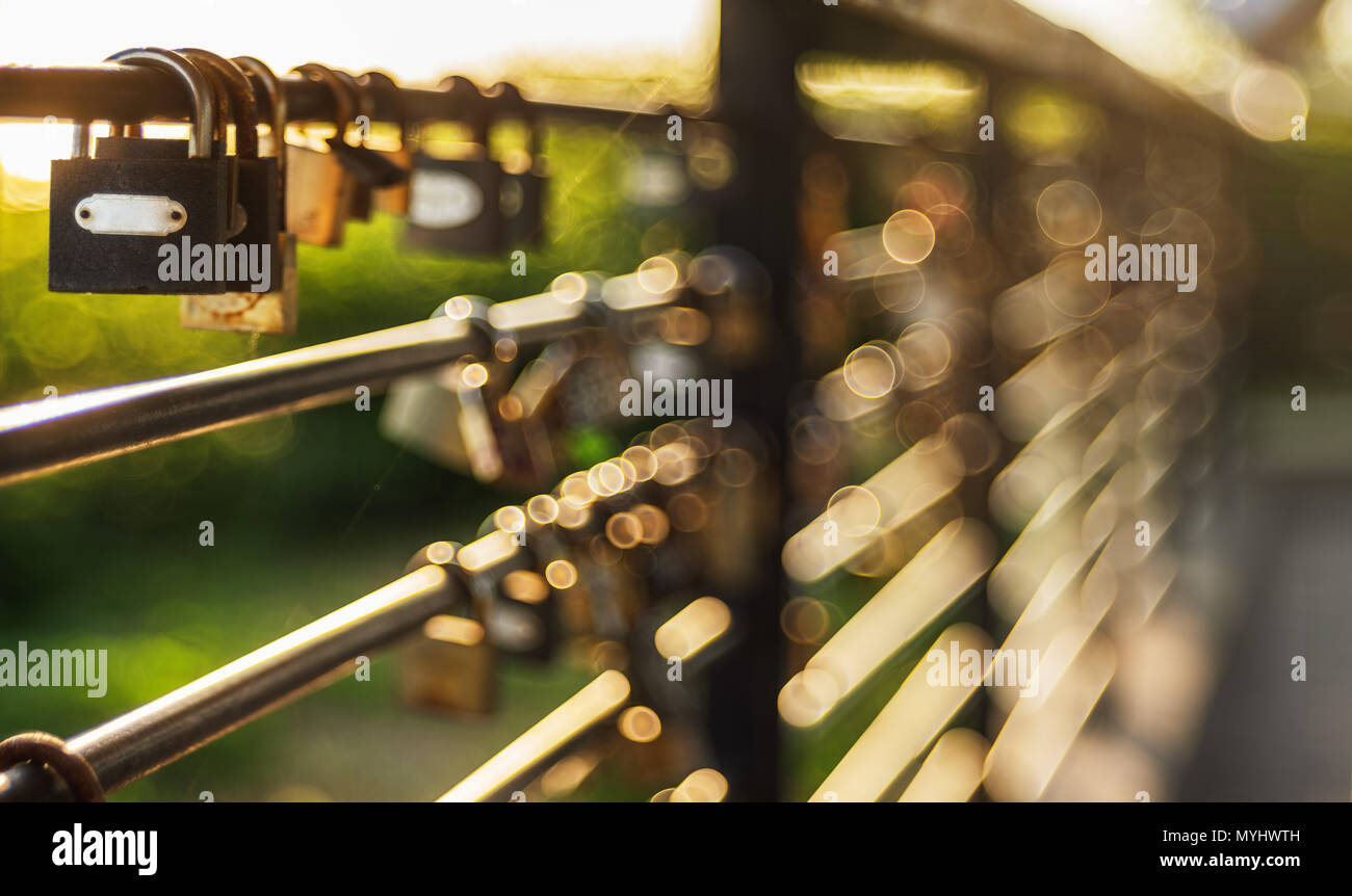 Padlock on a wire garden fence Stock Photo - Alamy