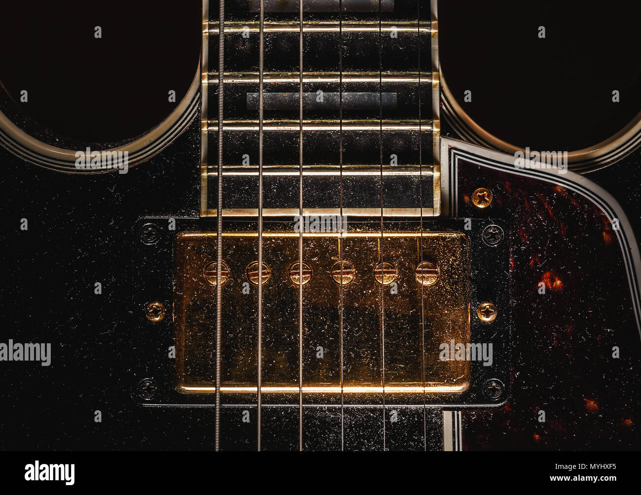 Details of an old dusty electric guitar Stock Photo - Alamy