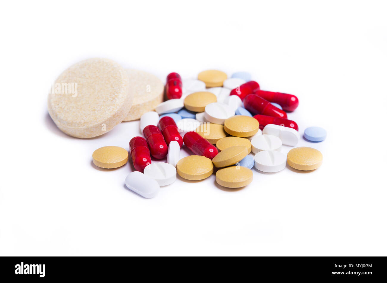 Colored pills over white Stock Photo - Alamy