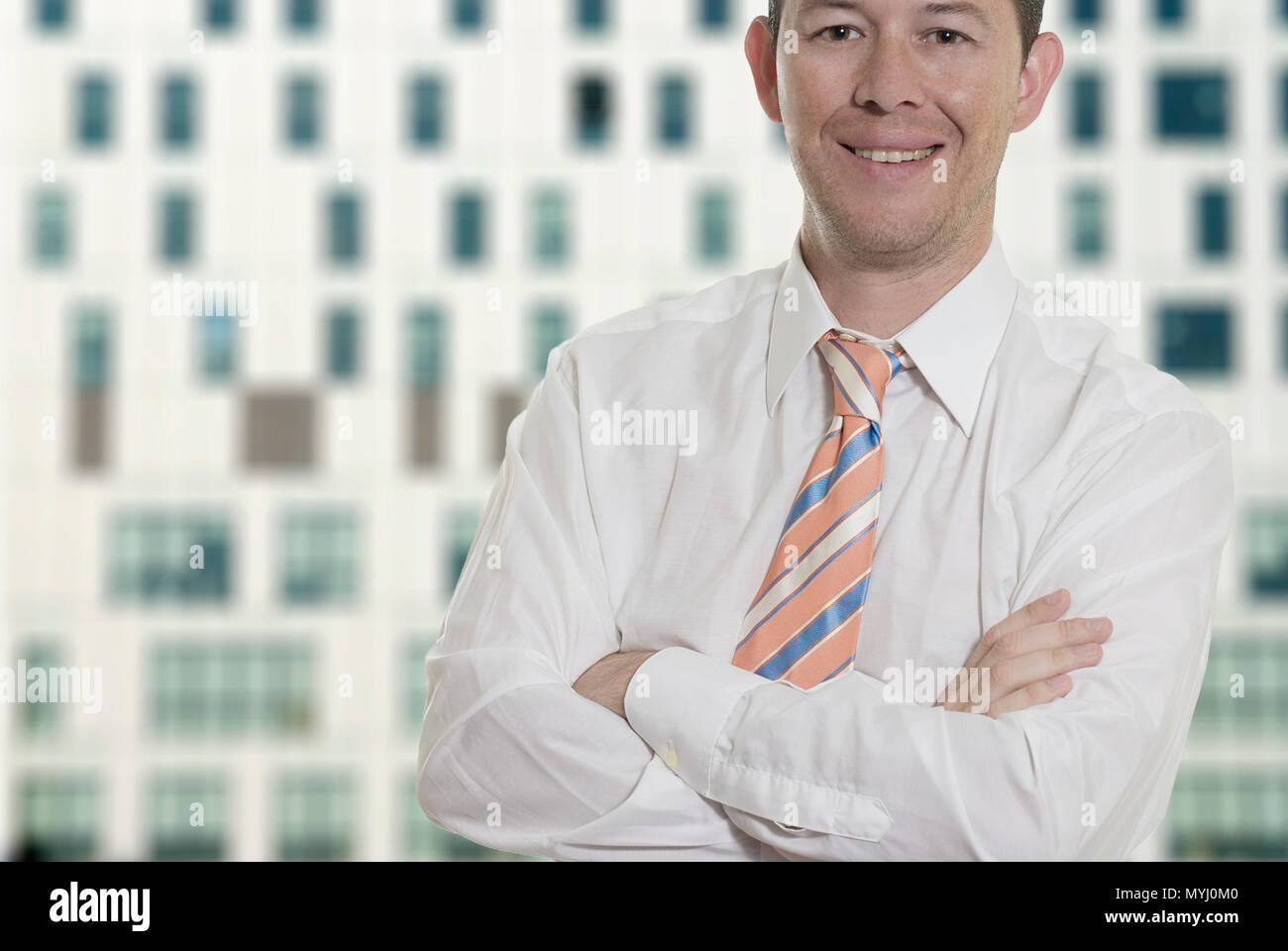 Business man arm crossed smiling Stock Photo - Alamy Business man arm crossed smiling Stock Photo - Alamy
