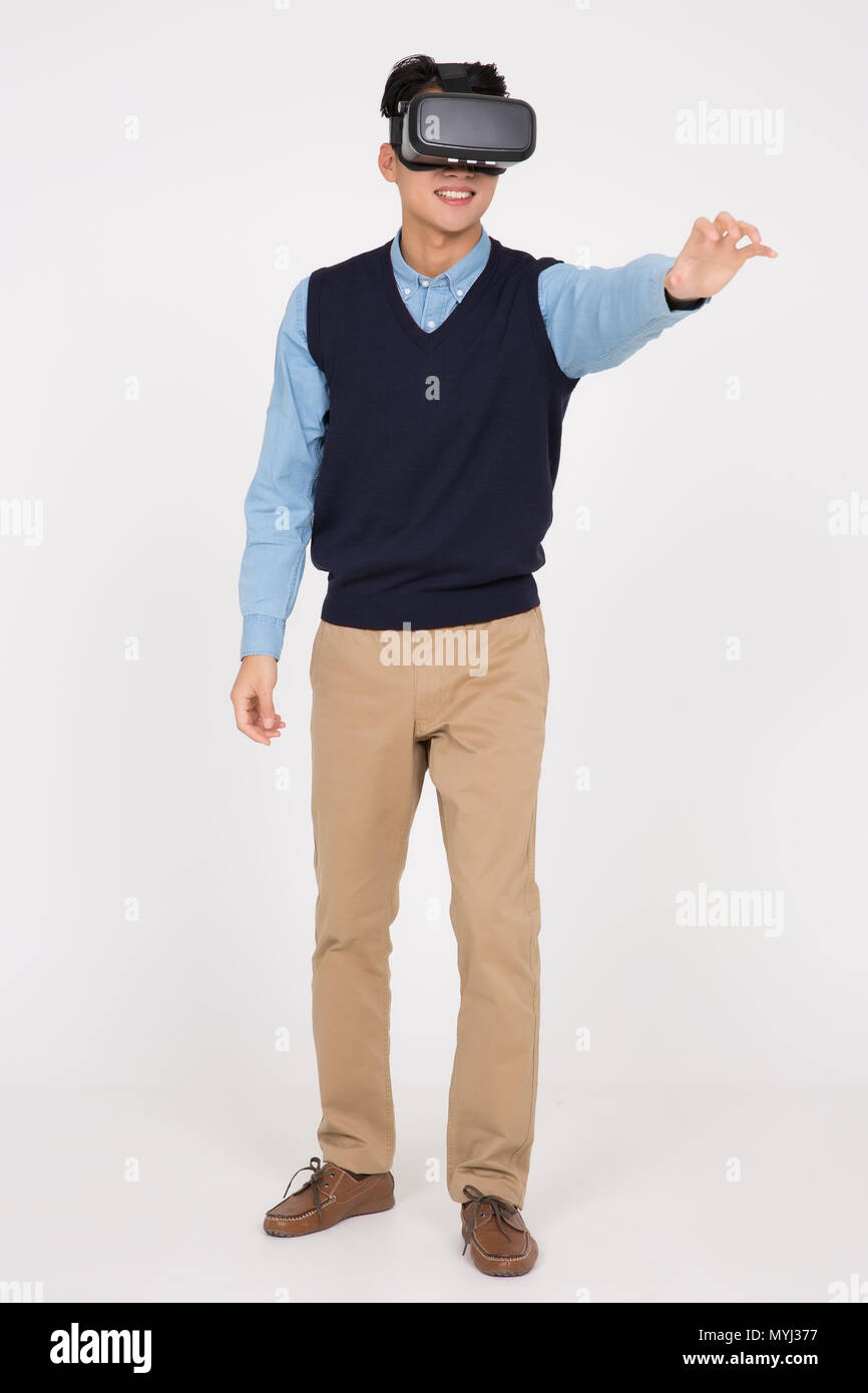 young man using a VR headset and experiencing virtual reality isolated ...