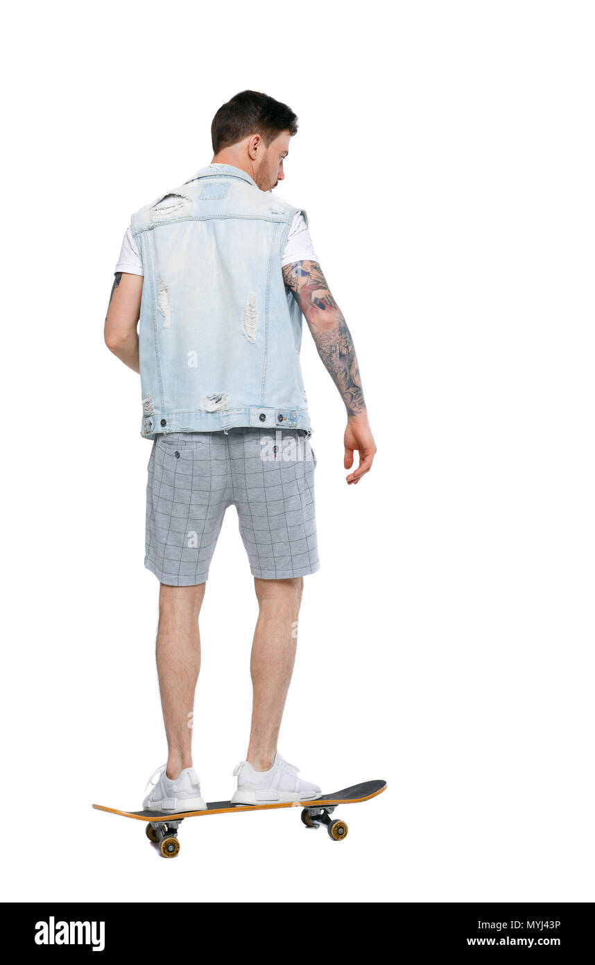 Back view of a man with a skateboard. Rear view people collection ...