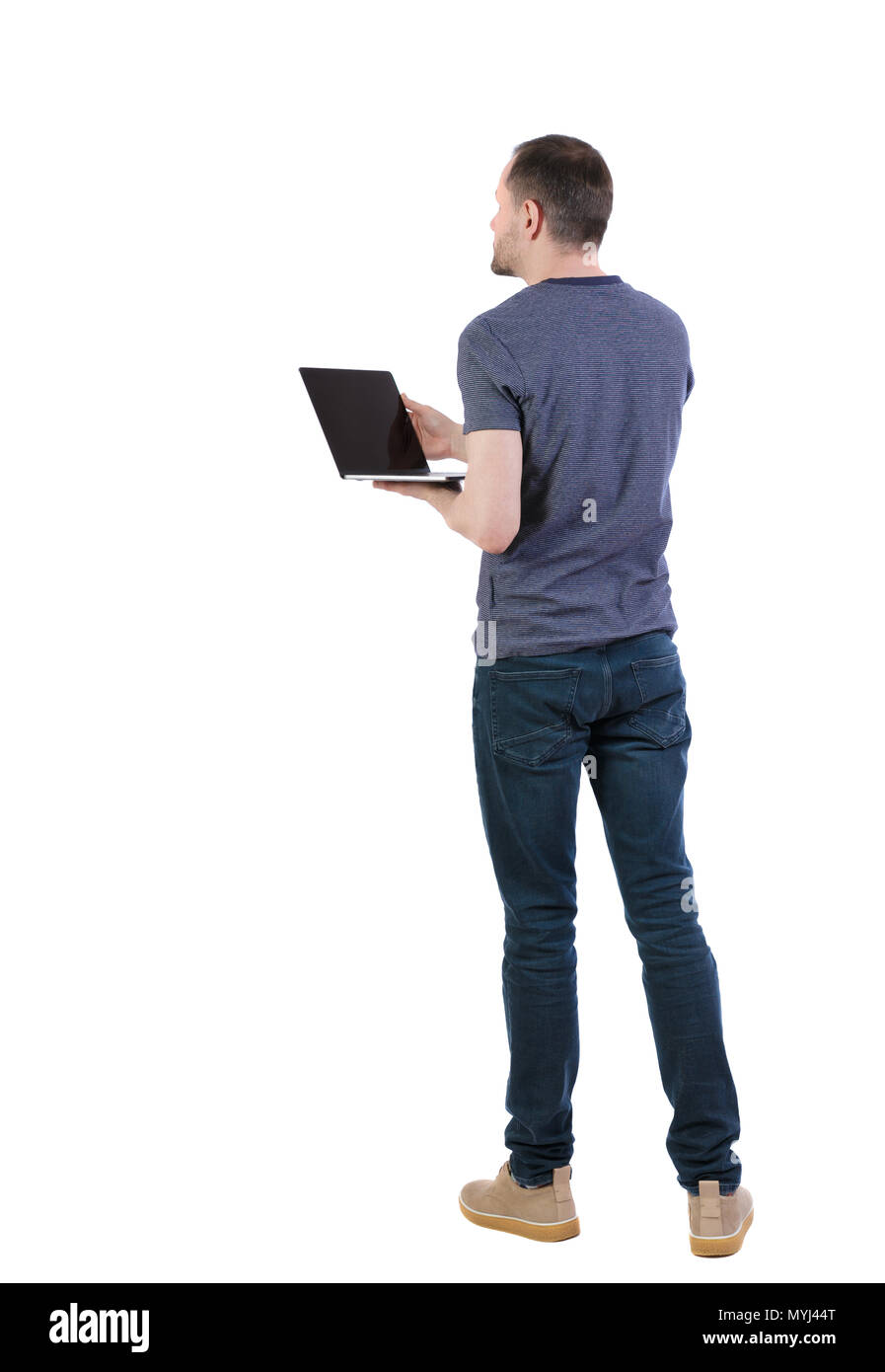 Back view of a man who is standing with a laptop. Rear view people ...