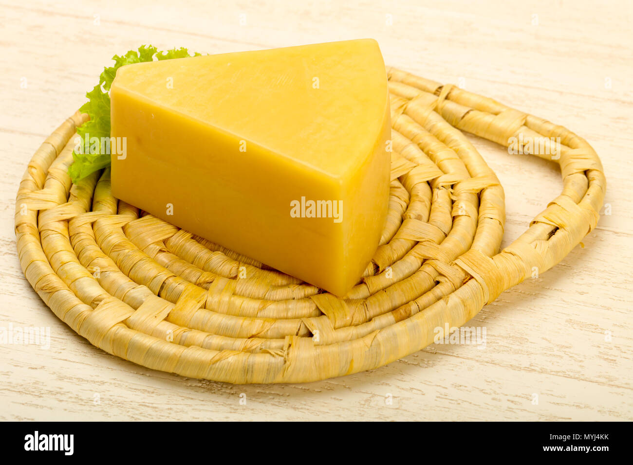 Parmesan cheese triangle Stock Photo - Alamy