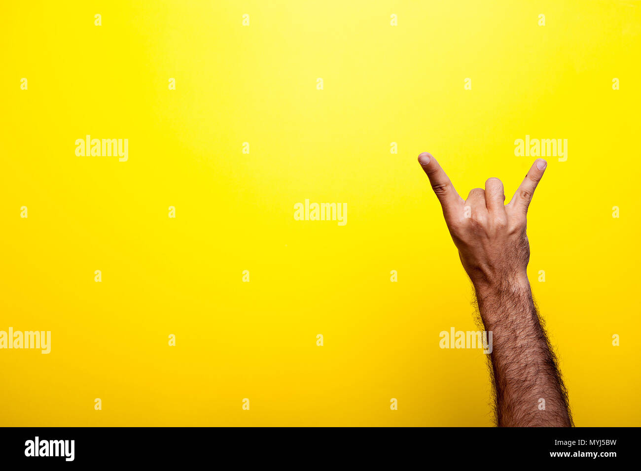 Male hand showing rock hi-res stock photography and images - Alamy