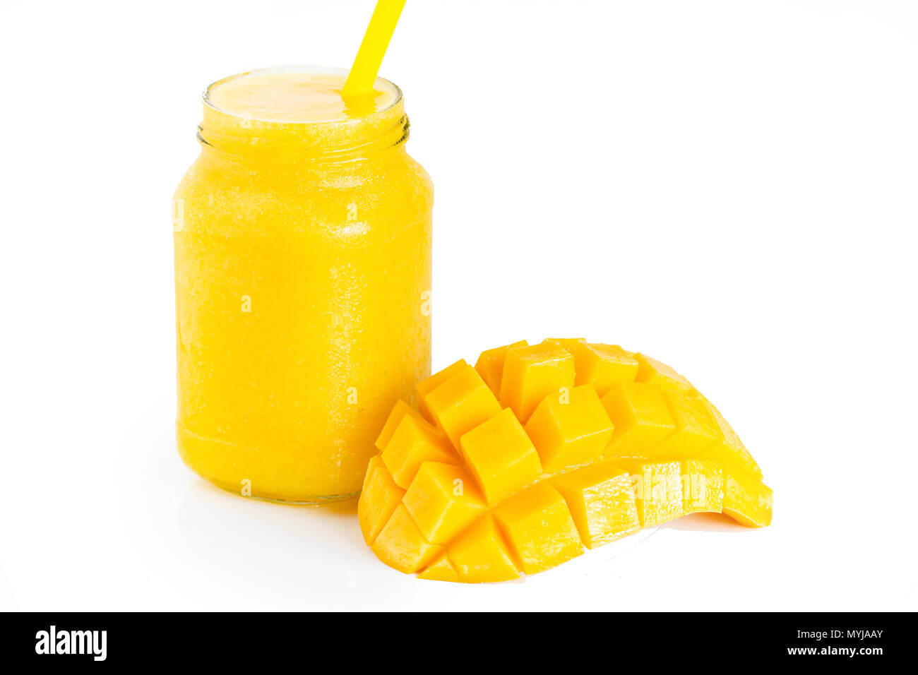 Yellow Mango juice In a glass And mango isolated background Stock Photo ...
