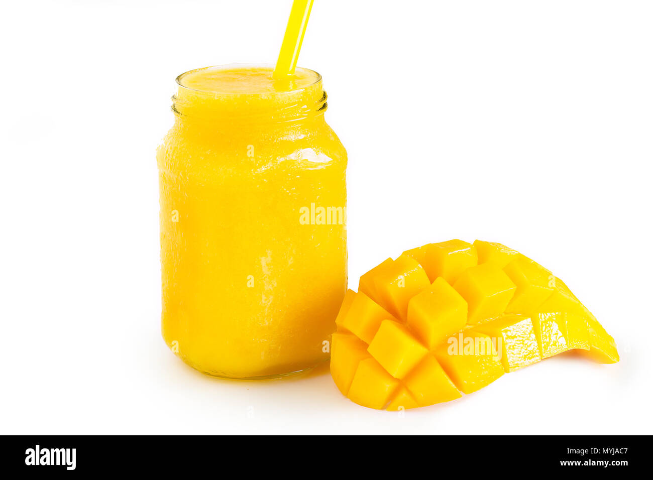 Yellow Mango juice In a glass And mango isolated background Stock Photo ...