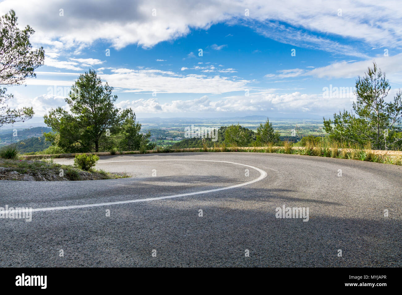 Mallorca, Road turn in mountainous landscape with clear views over ...