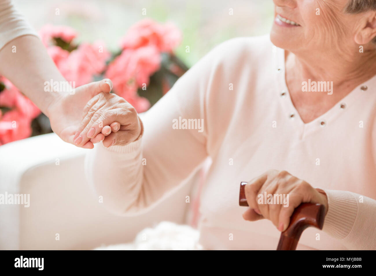 Elderly woman hands walking stick hi-res stock photography and images ...