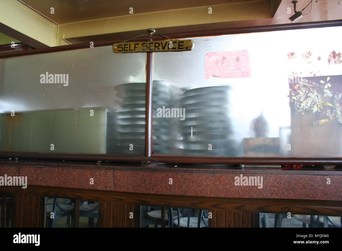 Self Service Sign in cafe, Darjeeling, India Stock Photo - Alamy
