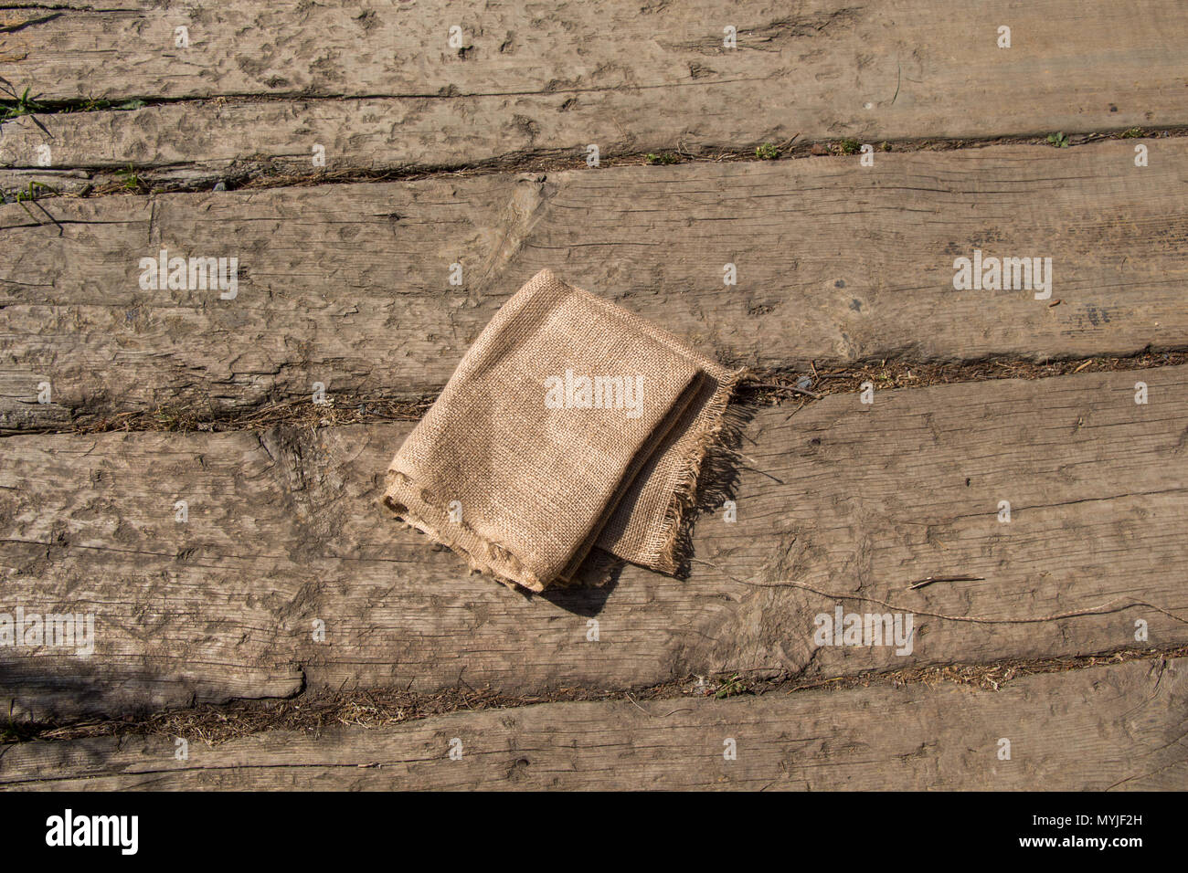 Brown color natural linen texture fabric on wood Stock Photo - Alamy