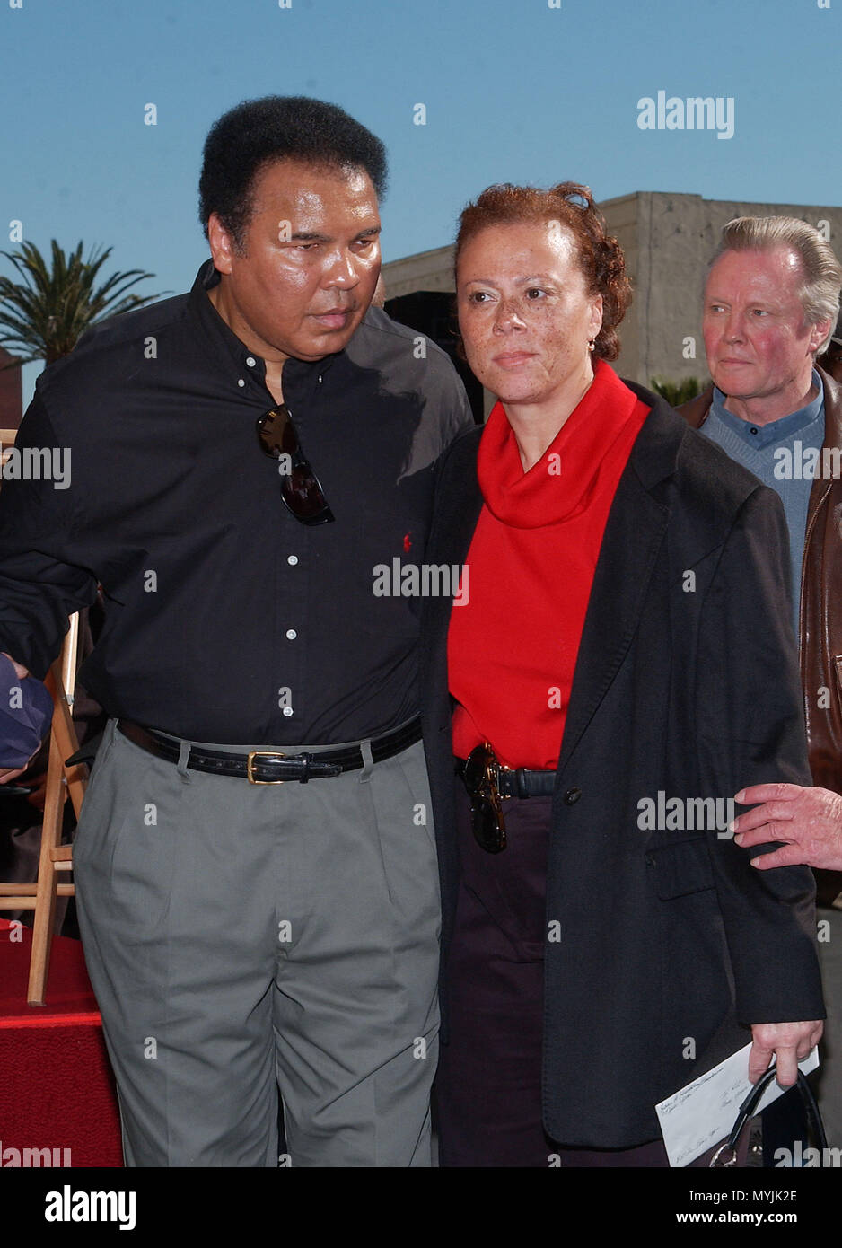 Muhammad Ali posing with his wife at the ceremony for his induction on ...