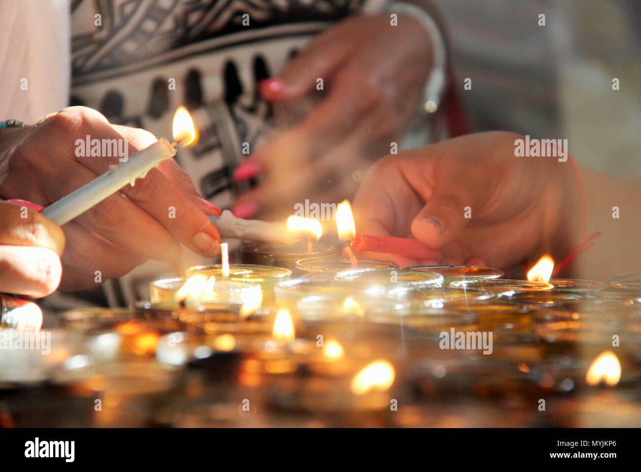 Women lighting fire hi-res stock photography and images - Alamy