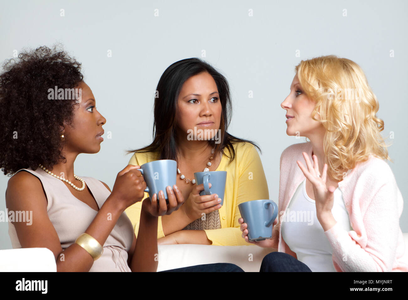 Diverse group of friends talking and laughing Stock Photo - Alamy