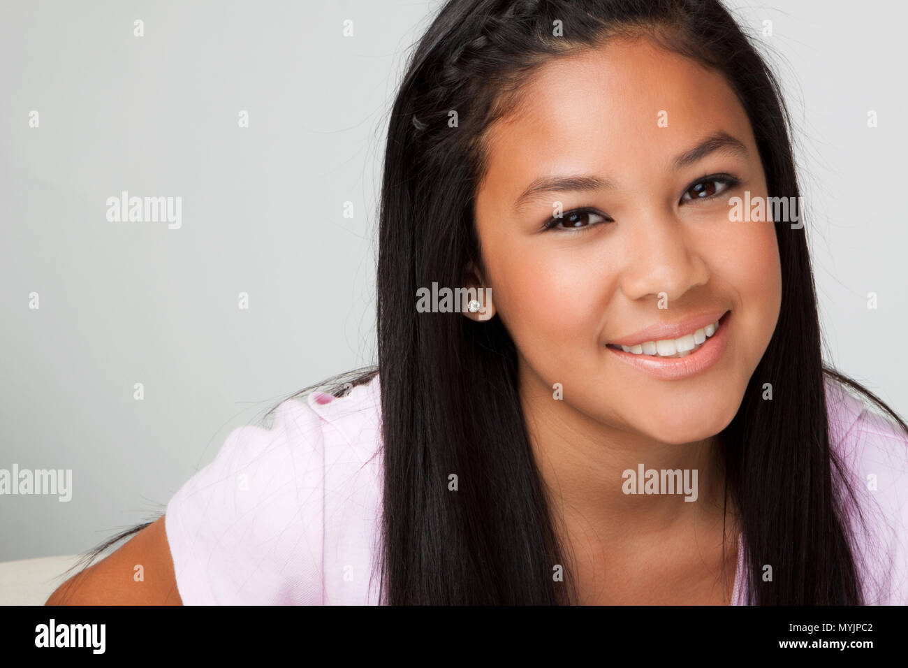 Portrait of an Asian teenage girl smiling Stock Photo - Alamy