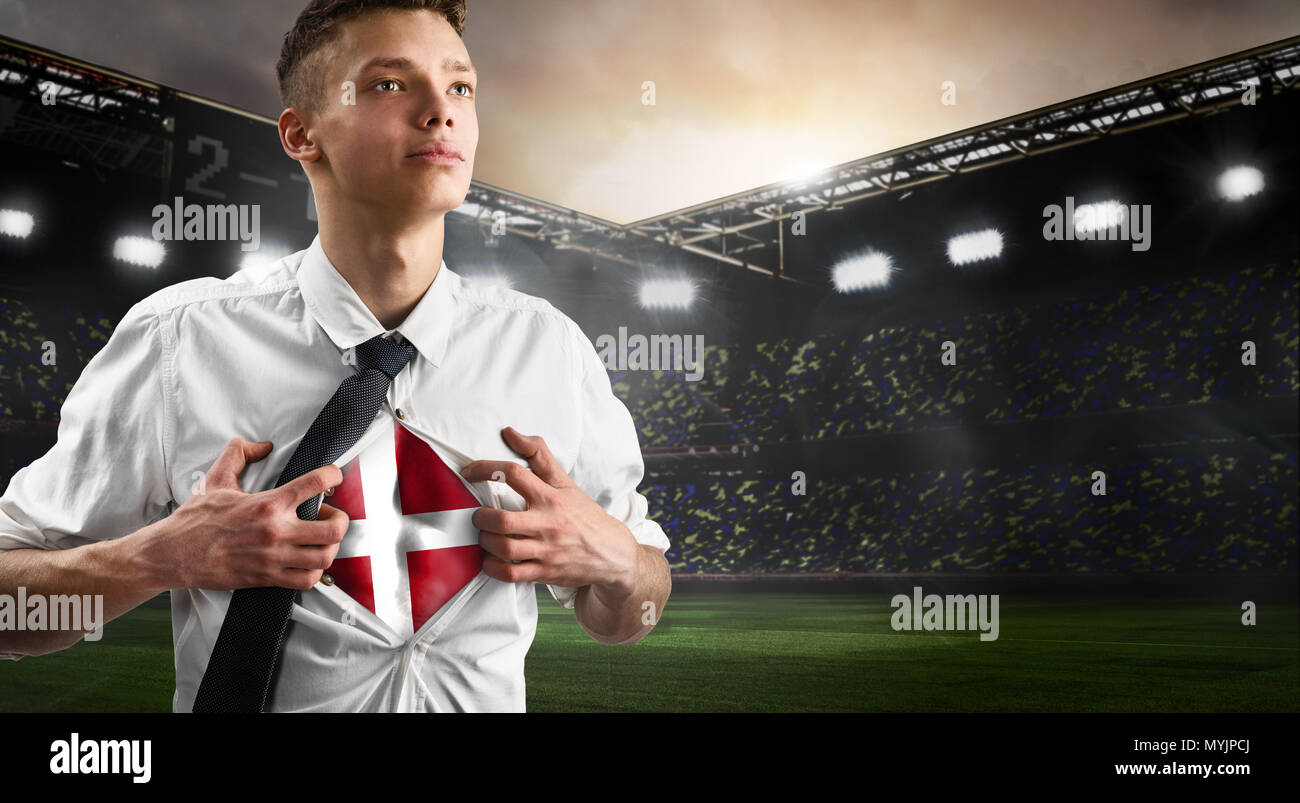Denmark soccer or football supporter showing flag Stock Photo - Alamy